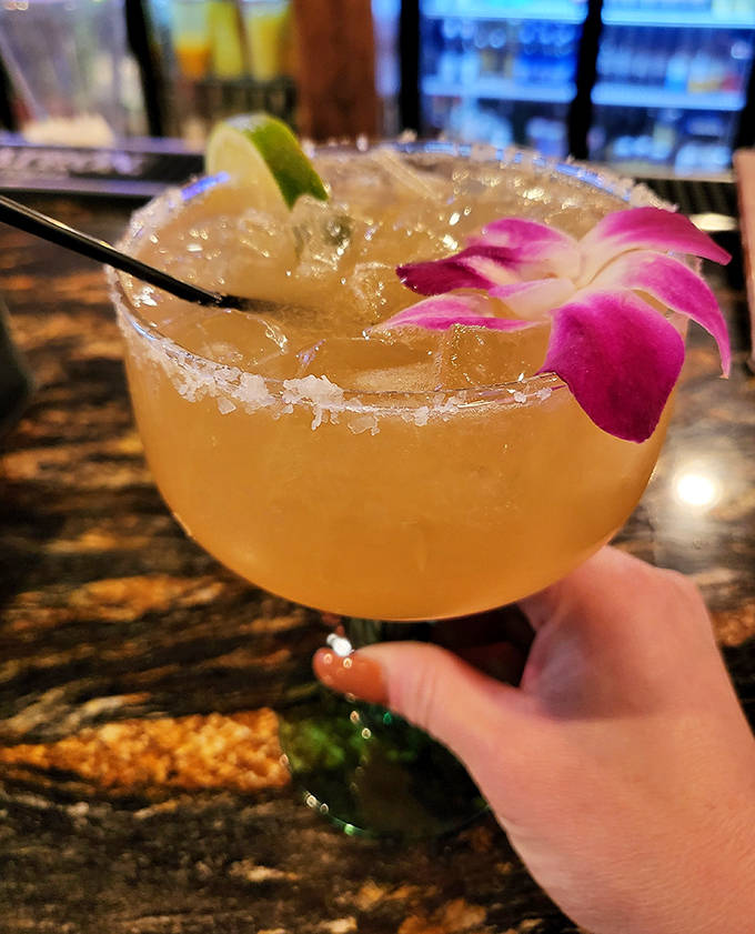 Their margarita comes adorned with a flower, as if to say, "Yes, this drink is pretty, but don't be fooled &ndash; there's serious tequila in here."