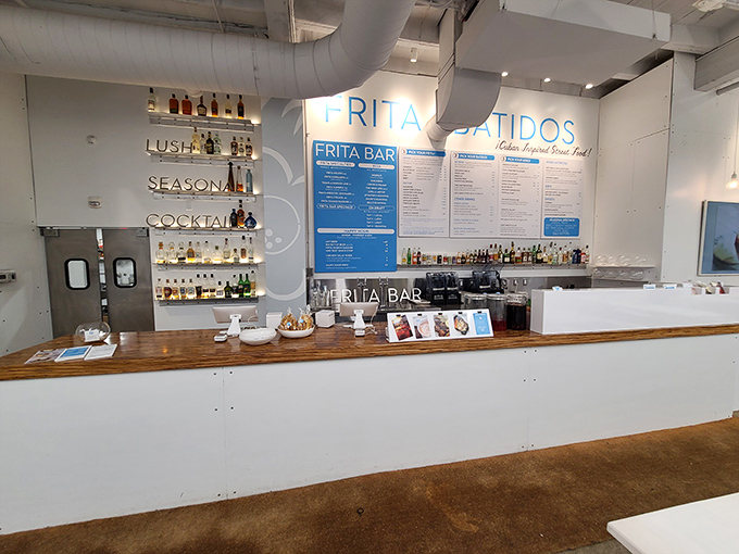 The bar area showcases an impressive array of spirits ready to transform into mojitos and daiquiris that would make Hemingway himself raise a glass.