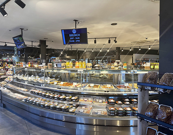 The deli counter gleams with prepared foods ready to rescue dinner time – proof that "gas station food" can be a compliment, not an insult.