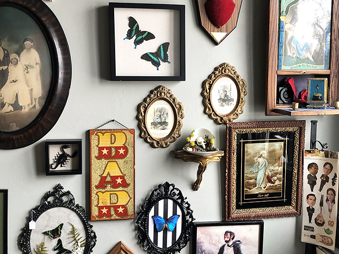 A gallery wall that tells a thousand stories &ndash; from preserved butterflies to vintage portraits, each frame holds its own little universe.