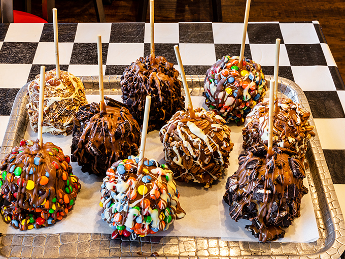 Gourmet chocolate apples that elevate the carnival classic to art form &ndash; crisp fruit beneath layers of decadent chocolate and creative toppings.