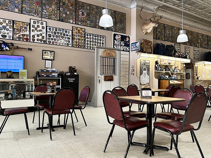 Police patches and badges line the walls, creating a museum-like atmosphere where law enforcement history meets pastry perfection.