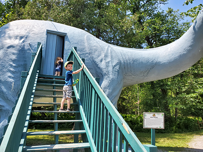 Family bonding reaches prehistoric proportions as kids discover that dinosaur tails make excellent jungle gyms.