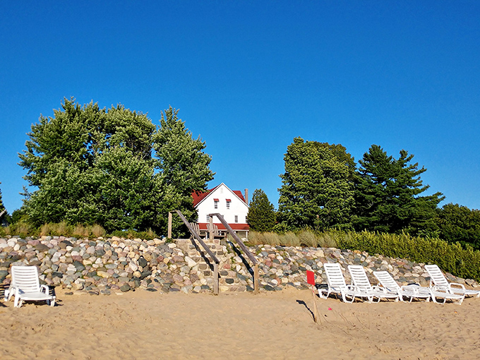 Beach chairs lined up like patient sentinels, waiting for visitors to sink in and let Lake Leelanau's gentle waves wash away real-world worries.