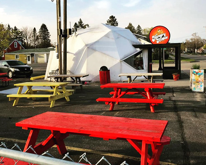 The outdoor dining area with its cheerfully painted picnic tables invites you to soak up Michigan sunshine while soaking up good vibes and great food.