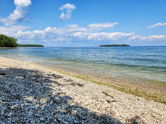 Crystal clear waters reveal every pebble along the shoreline, nature's own version of high-definition that no screen could match.