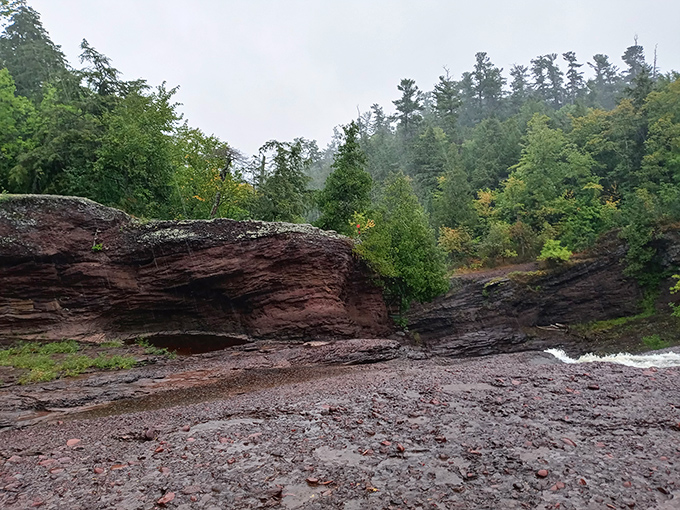 Billion-year-old storytellers: These ancient rock formations have witnessed epochs pass while the persistent water slowly sculpts their rugged faces.