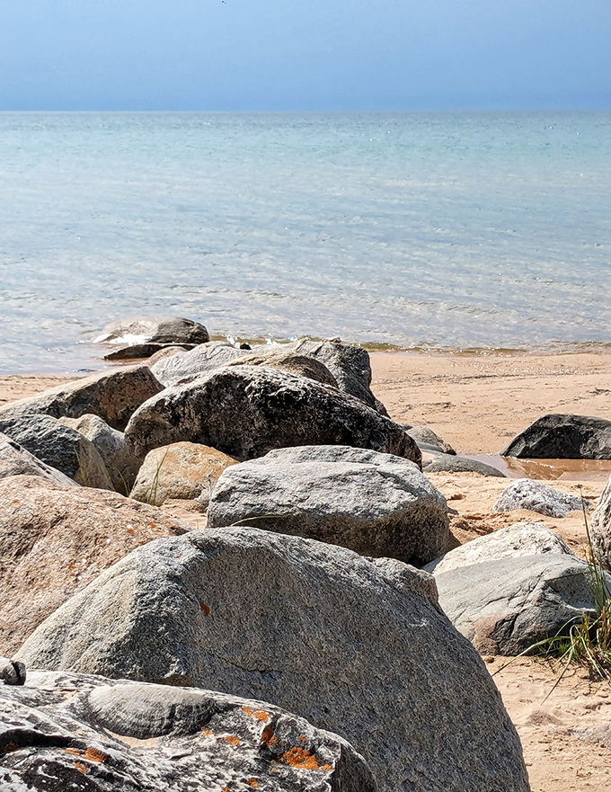 Nature's breakwater creates perfect pools for tiny explorers to discover miniature underwater worlds.
