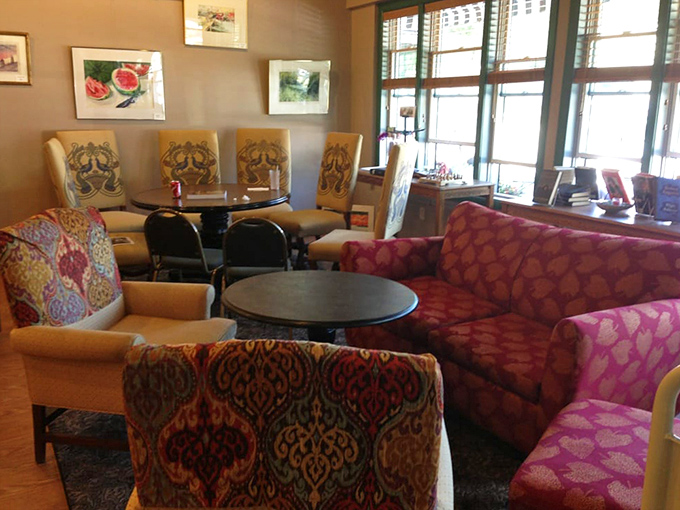 Plush chairs in vibrant patterns invite you to sink in, sip slowly, and lose track of time between pages.