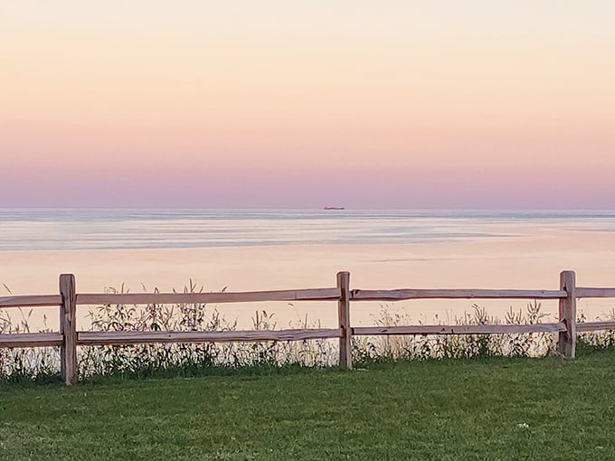 Pastel skies reflect on the calm waters at dusk, creating a double display of nature's artistry that stops conversations mid-sentence.