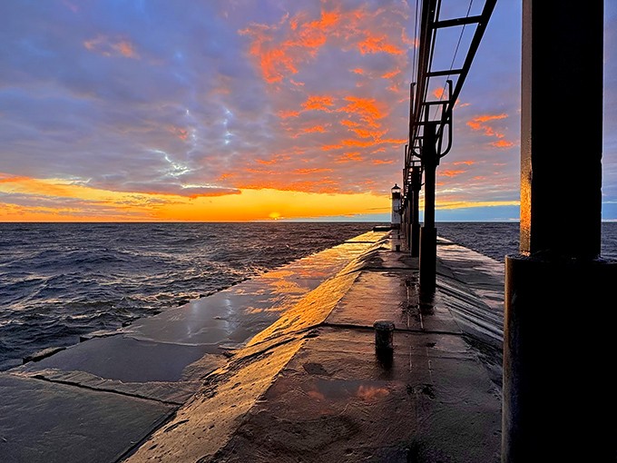 Golden hour transforms the pier into a magical pathway, where water reflects the sky's dramatic palette and everyday worries simply melt away.