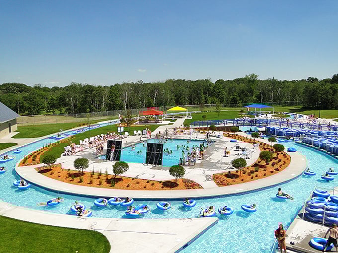 Visitors relax while floating along the lazy river and gather at the central pool for a perfect sunny day at the park.