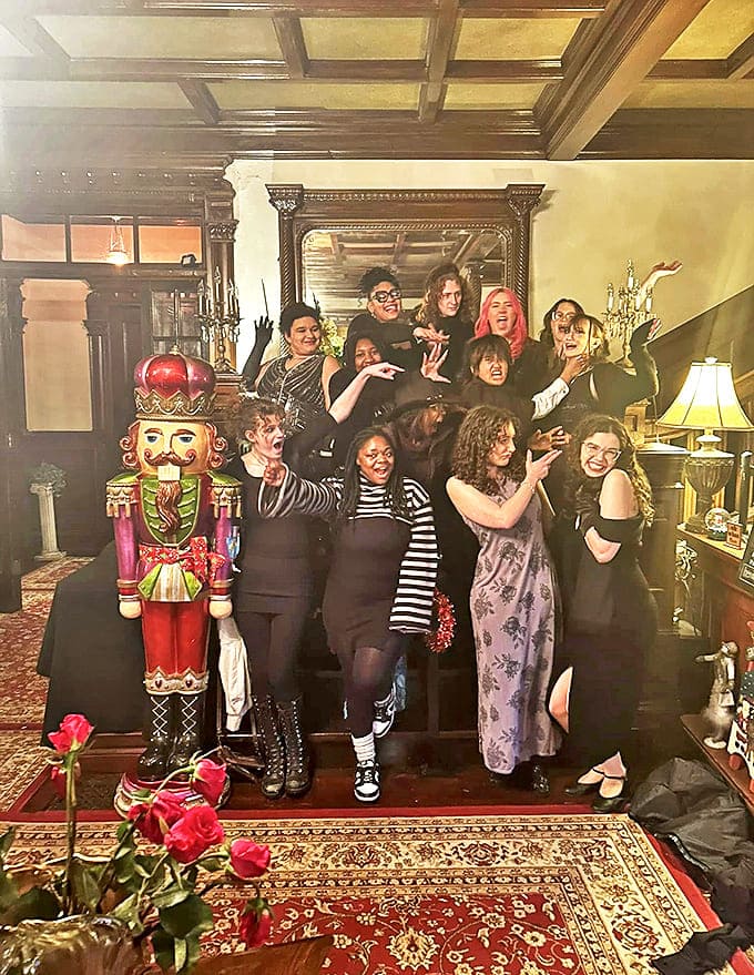 Visitors: Laughter echoes through historic halls as guests pose dramatically&mdash;perhaps hoping to capture an additional, uninvited figure in their souvenir photo.