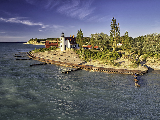 The lighthouse peninsula juts dramatically into Lake Michigan, creating a picture-perfect scene from any angle.