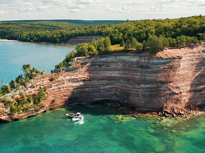 The boat looks like a toy from up here, reminding us we're just temporary visitors in nature's grand living room.