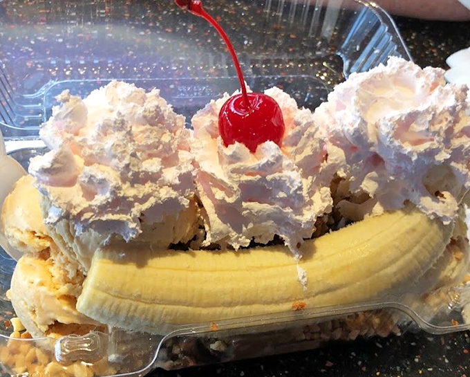 This banana split isn't just dessert, it's architecture &ndash; a carefully constructed monument to the art of excess topped with a cherry exclamation point.