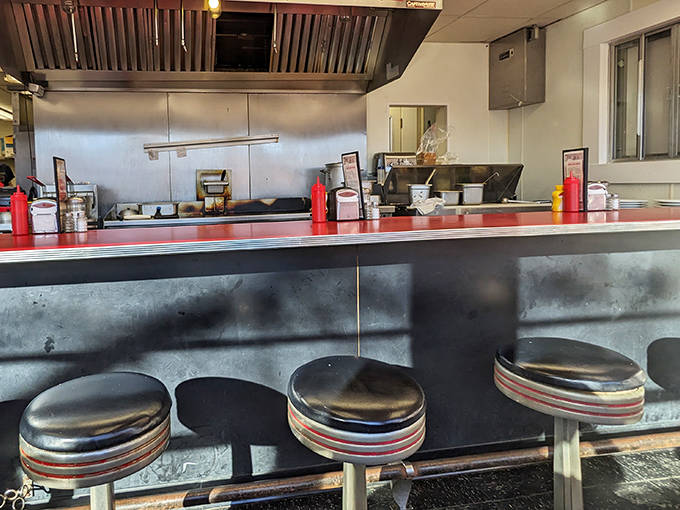 The counter isn't just for eating – it's where strangers become friends and regulars catch up on neighborhood news between bites.