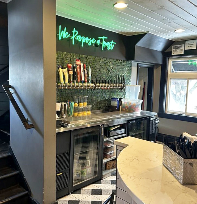 The bar area's cheeky neon sign "We Propose a Toast" perfectly captures the playful spirit behind every carefully crafted beverage.