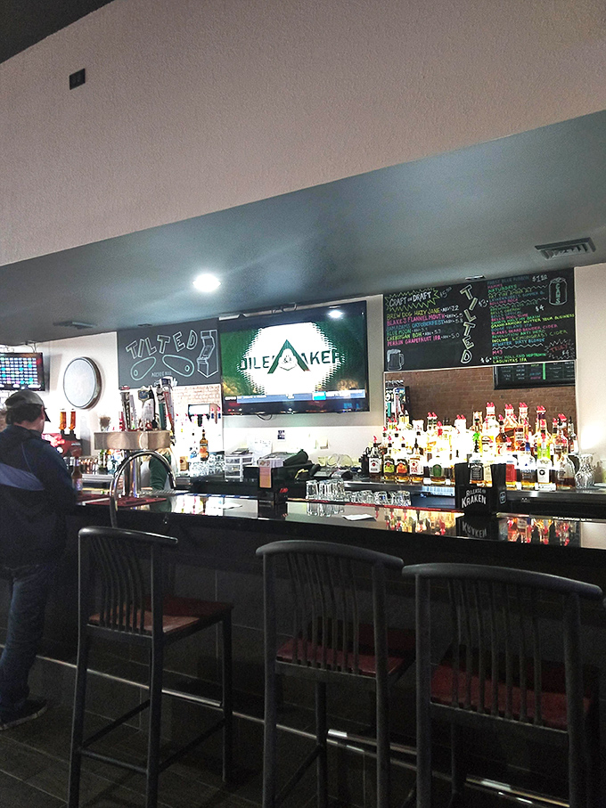 The well-stocked bar serves as command central, where gaming strategies are discussed and liquid courage is dispensed in equal measure.