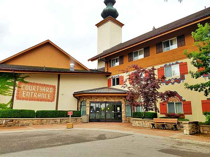 The Courtyard entrance welcomes visitors with traditional Bavarian architecture, warm colors, and thoughtful landscaping that sets the European tone.