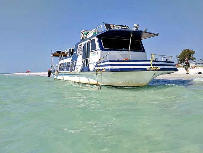 Beached Tour Boat: Island transportation, Bean Point style &ndash; where even the boats seem to be taking a break from the hustle.