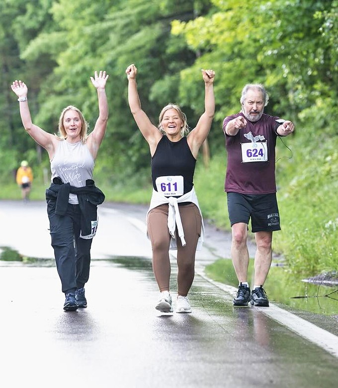 The Canal Run attracts participants of all abilities, their triumphant expressions capturing the joy of community athletic events.