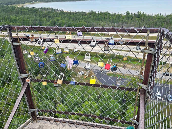 Love locks cling to the fence like metallic promises, each one a tiny declaration of devotion with a view.