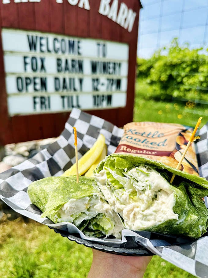 The chicken salad wrap arrives in a vibrant spinach tortilla, offering a fresh counterpoint to wine tastings and proof that barn food isn't just cheese plates.