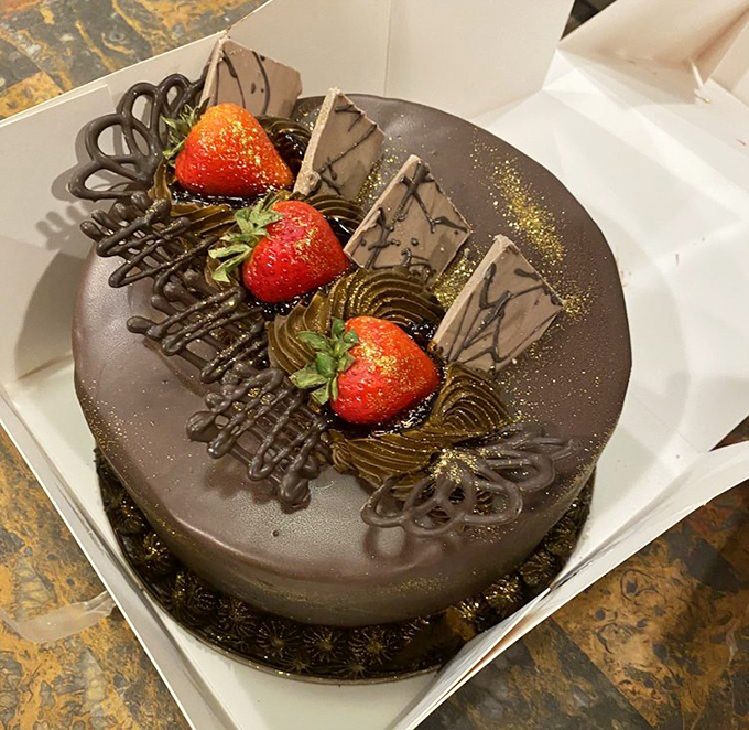 This chocolate masterpiece crowned with fresh strawberries isn't just a cake &ndash; it's an architectural marvel that belongs in both museums and on plates.