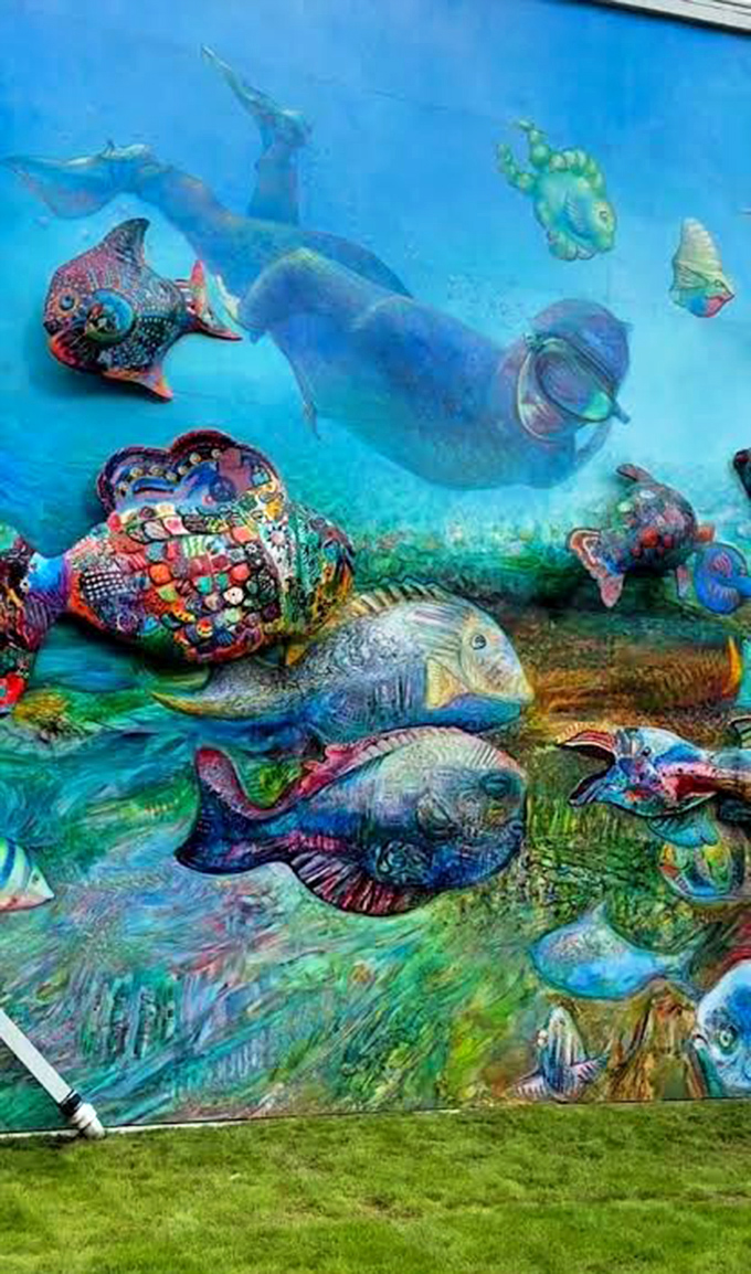 Close inspection reveals the meticulous detailing on each fish – patterns that would make fashion designers jealous and marine biologists nod in approval.