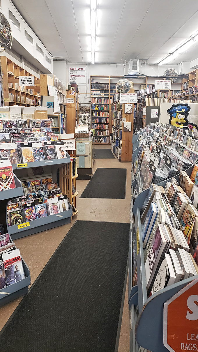 Down the rabbit hole you go! These narrow pathways between towering shelves are where afternoon browsing plans mysteriously transform into evening adventures.