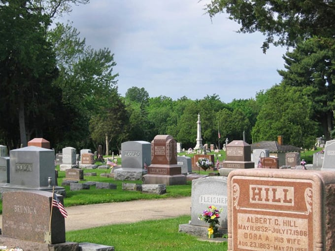 Sunlight plays across the varied monuments, highlighting the craftsmanship that went into creating these lasting tributes to loved ones.