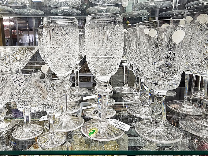 Crystal stemware catches the light, each piece waiting to elevate someone's next dinner party.