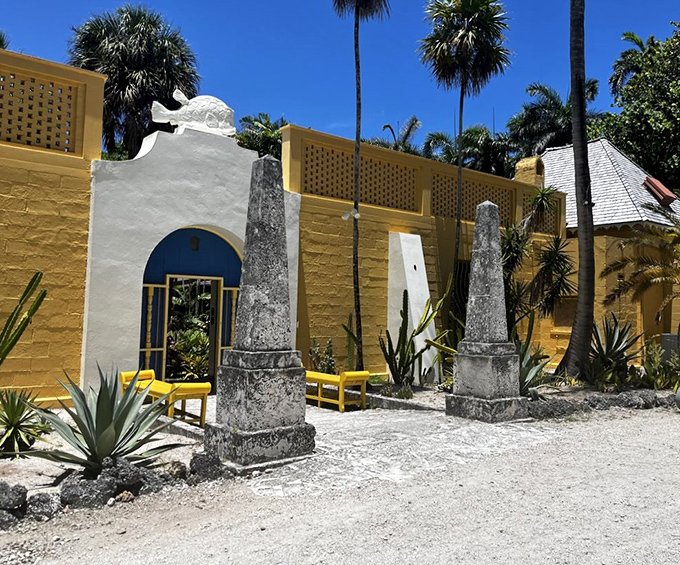 Ancient-looking obelisks stand guard at the garden entrance, as if protecting treasures from a Florida version of ancient Egypt.