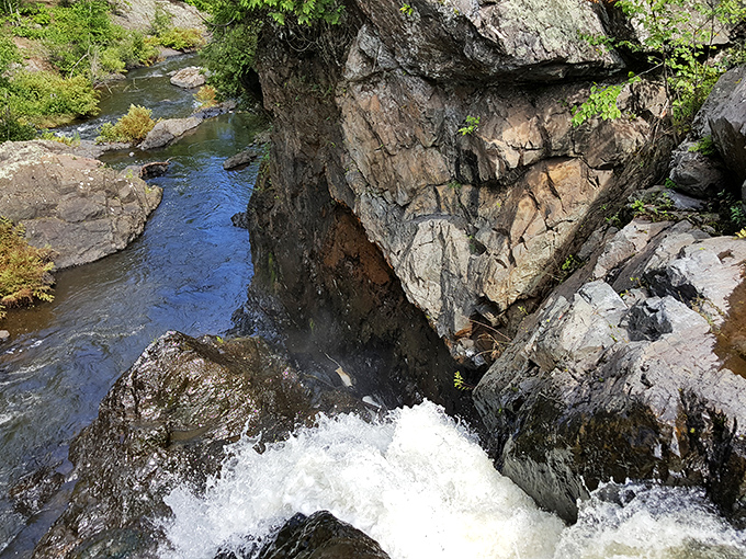 From above, the falls reveal their full power as water crashes through narrow channels in the ancient rock.