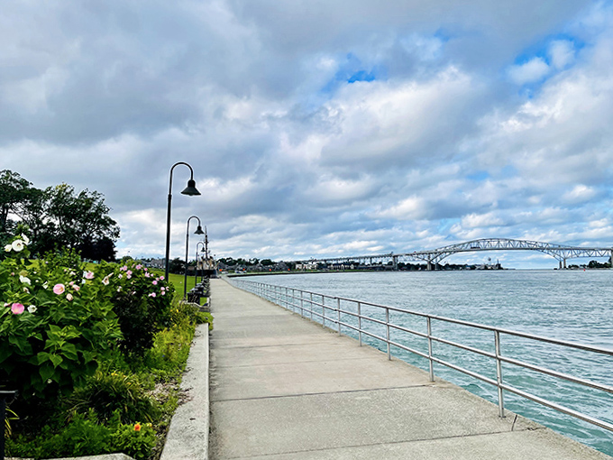 Spring brings bursts of color along the trail, where carefully tended flowers frame the path and complement the natural beauty of the waterway.
