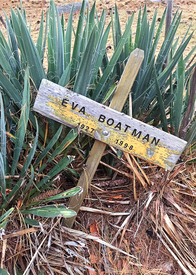 Eva Boatman's humble wooden marker from 1998 reminds us that even in modern times, simple memorials can carry profound emotional weight.