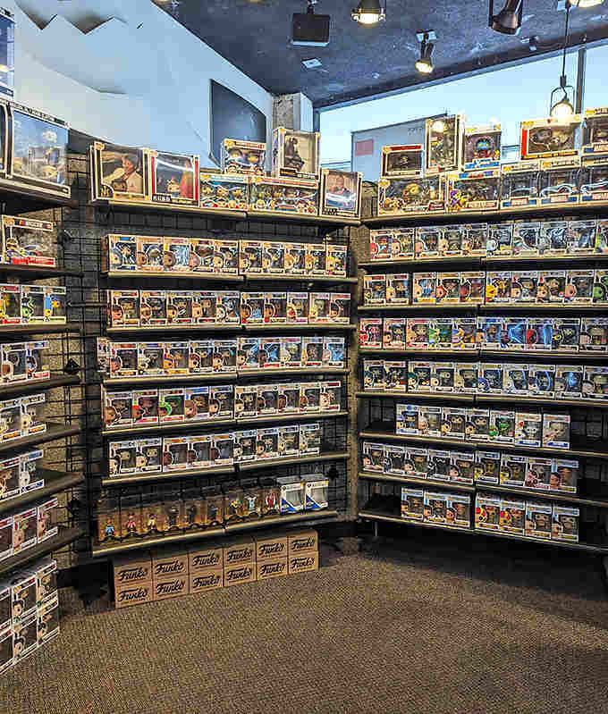 Funko Pop! figures stand at attention like a plastic army of pop culture, their oversized heads nodding in approval at your excellent taste.