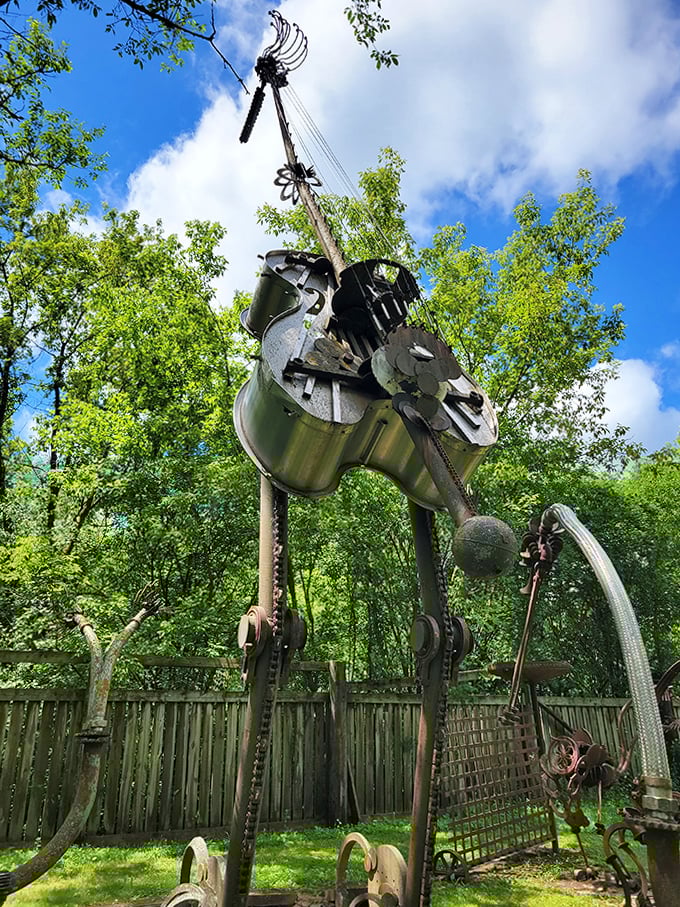 A mechanical string instrument reaches skyward, as if trying to pluck notes from passing clouds.