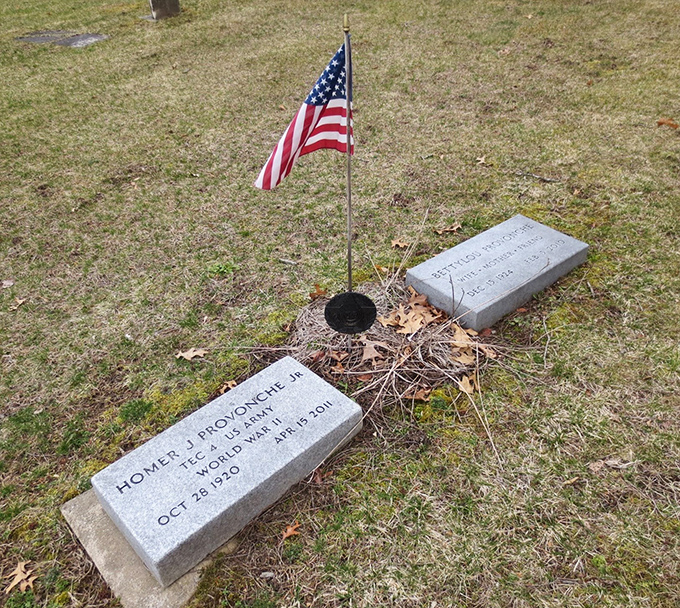 Veterans like Homer Provonche rest among Findlay's supernatural residents, their service honored with flags that flutter in mysterious breezes.