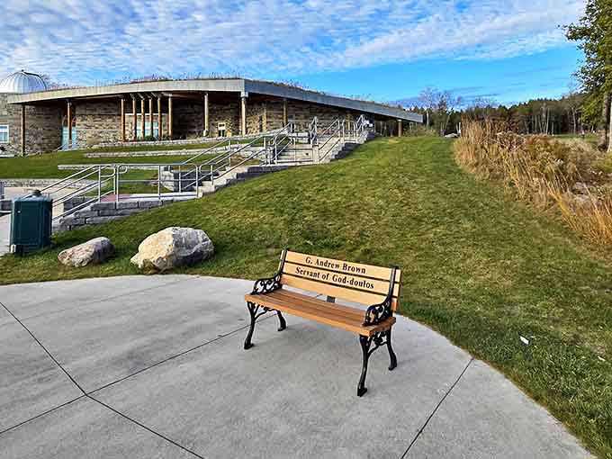 A memorial bench offers the perfect spot for contemplating both human history and the ancient light of distant stars.