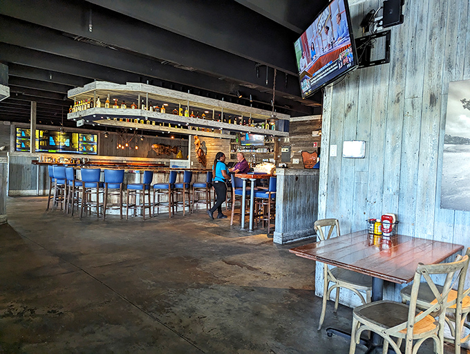 The indoor bar area balances rustic charm with comfortable sophistication &ndash; like your favorite jeans that somehow became appropriate for a nice dinner out.