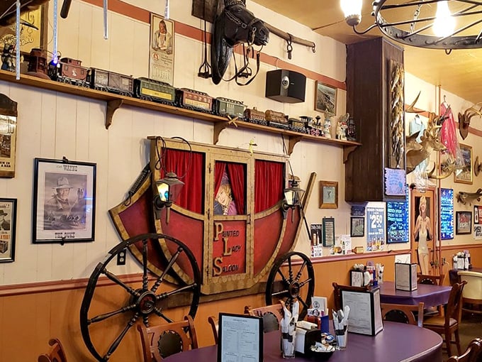 The stagecoach display isn't some calculated design element, it's a genuine piece of Americana that found its perfect home among the saloon's eclectic treasures.