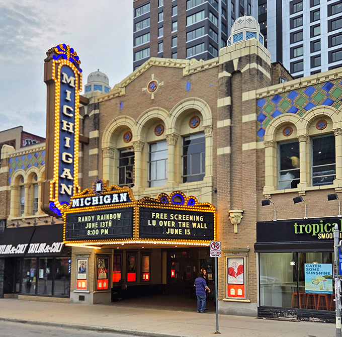 The Michigan Theater's iconic marquee lights up Liberty Street with vintage glamour, promising cinematic escapes in a setting that remembers when movies were events.