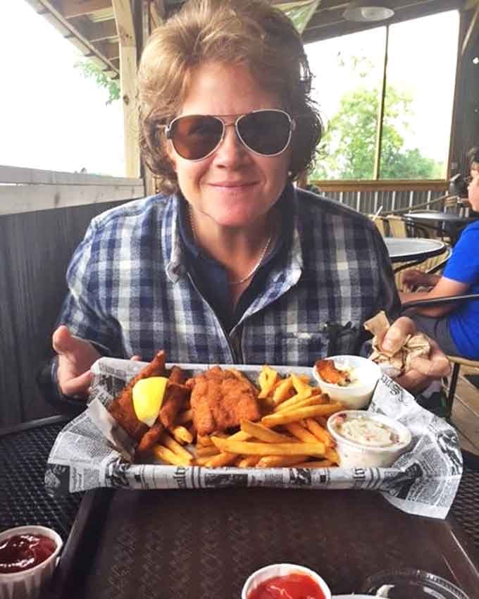 Happy diners experiencing the joy of perfectly prepared fish in Peterson's casual setting &ndash; where the food, not the ambiance, is the true luxury.