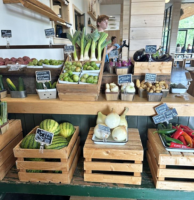 A cornucopia of just-harvested treasures &ndash; leeks stand tall among cabbage, potatoes, and watermelons in this farm-fresh display.