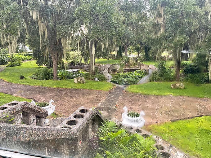Even on gray days, the Wonder House grounds maintain their charm, with rain enhancing the lush tropical setting.