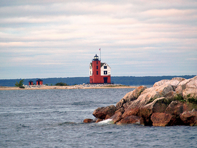 From this distance, the lighthouse appears to float mysteriously between water and sky, performing a magic trick that never gets old.