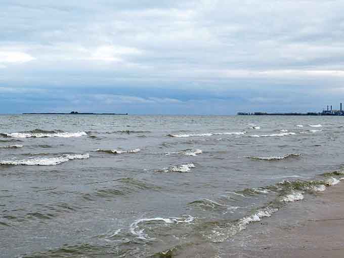 Saginaw Bay's gentle waves create a freshwater horizon so vast you might momentarily believe you're gazing at an inland ocean.
