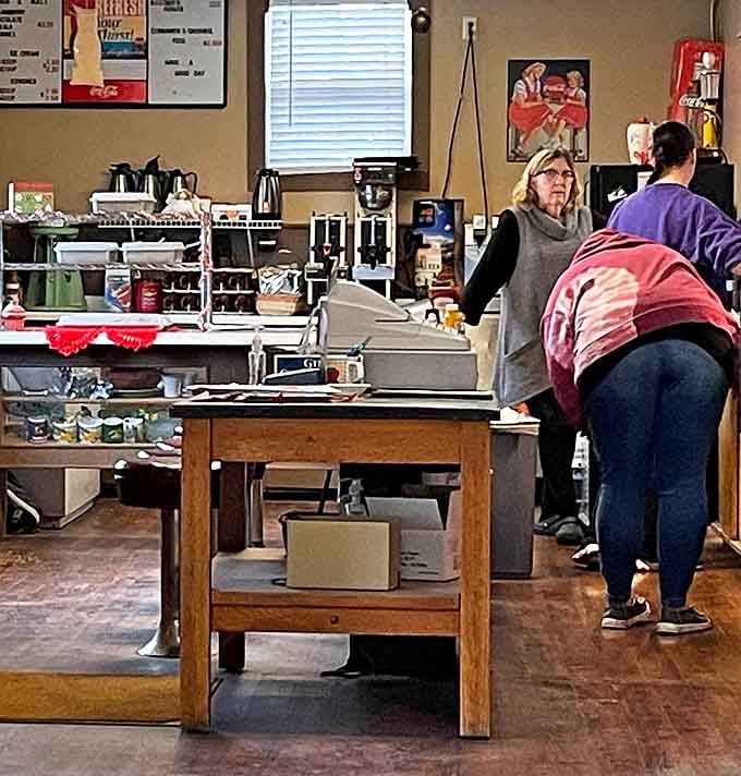 Behind the counter is where the magic happens – where orders are called and comfort food dreams come true.
